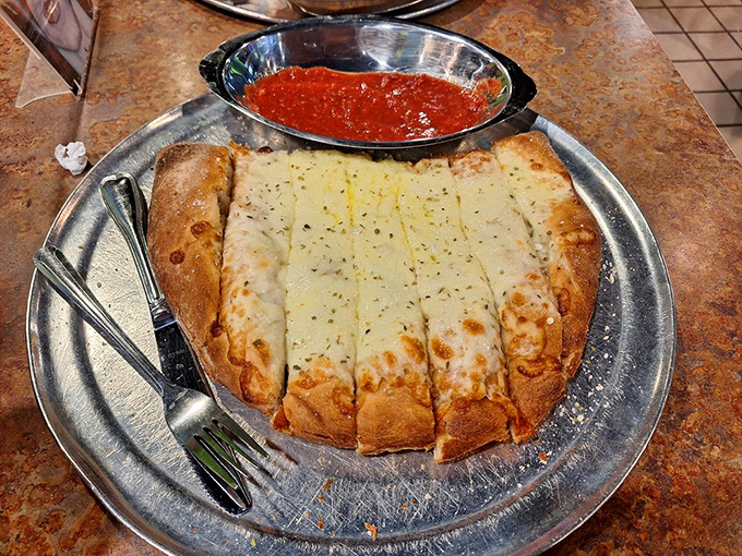 These breadsticks aren't merely pizza's opening act—they're golden-brown wands of garlic-buttered magic that deserve their own spotlight.