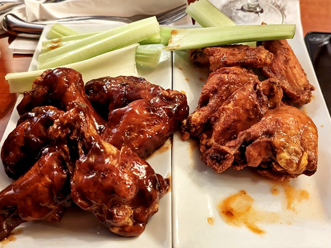 These wings aren't just sauced&mdash;they're baptized in flavor, offering both tangy buffalo and savory dry-rub options. Celery sticks stand by for cooling relief.