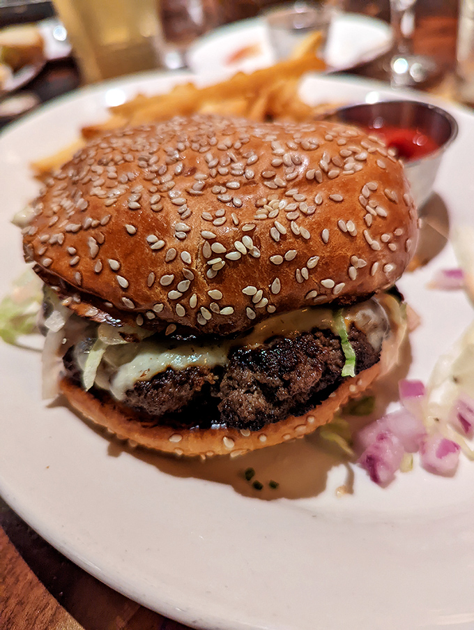 A burger that demands to be photographed before eaten&mdash;sesame-studded bun, perfectly charred patty, and toppings arranged with architectural precision.