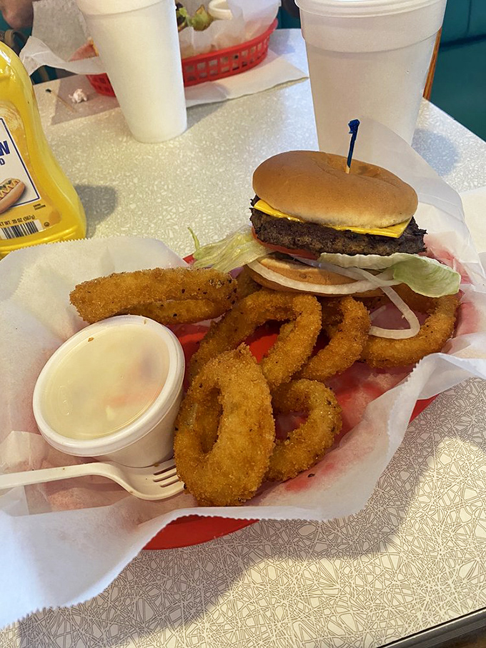 The classic burger-and-rings combo&mdash;where the onion rings form a golden fortress protecting a cheeseburger that means serious business.