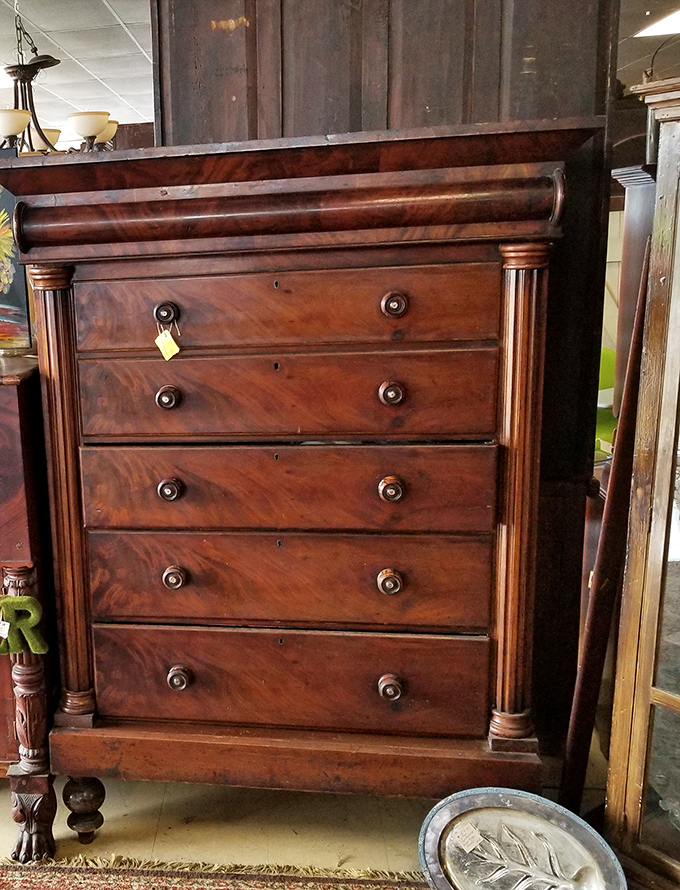 This mahogany chest of drawers has witnessed more history than your history teacher. Solid craftsmanship that makes modern furniture look like a temporary relationship.