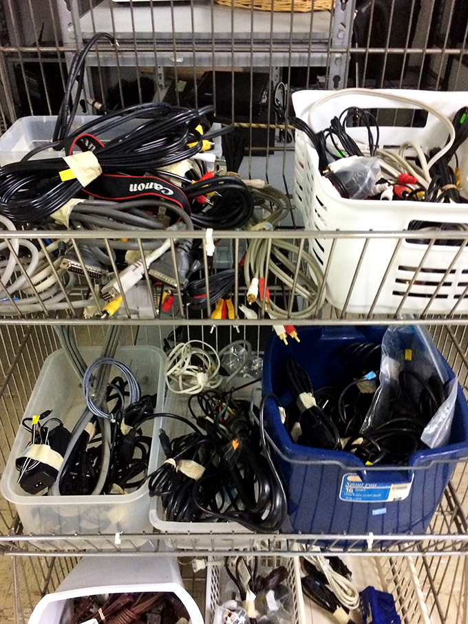 The technological graveyard where cables and cords await resurrection. Someone's electronic trash might be your connectivity treasure.