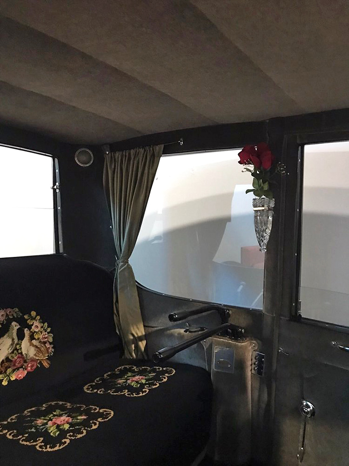Peek inside luxury from another era &ndash; delicate floral embroidery and a crystal bud vase remind us when cars were designed as elegant moving parlors.