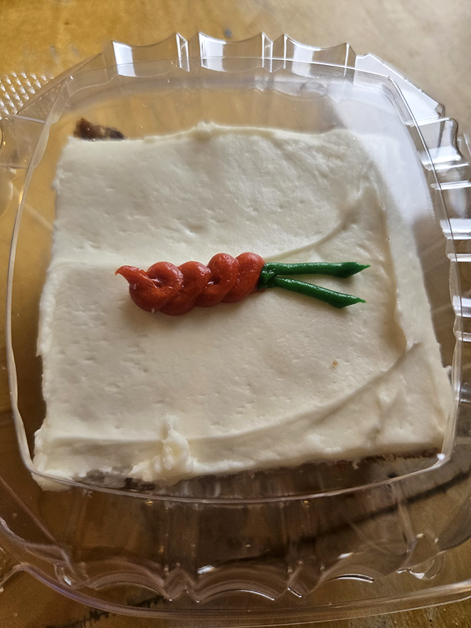 Carrot cake with a playful garnish that says, "Yes, I'm technically a vegetable dessert, but I'm still going to rock your world."