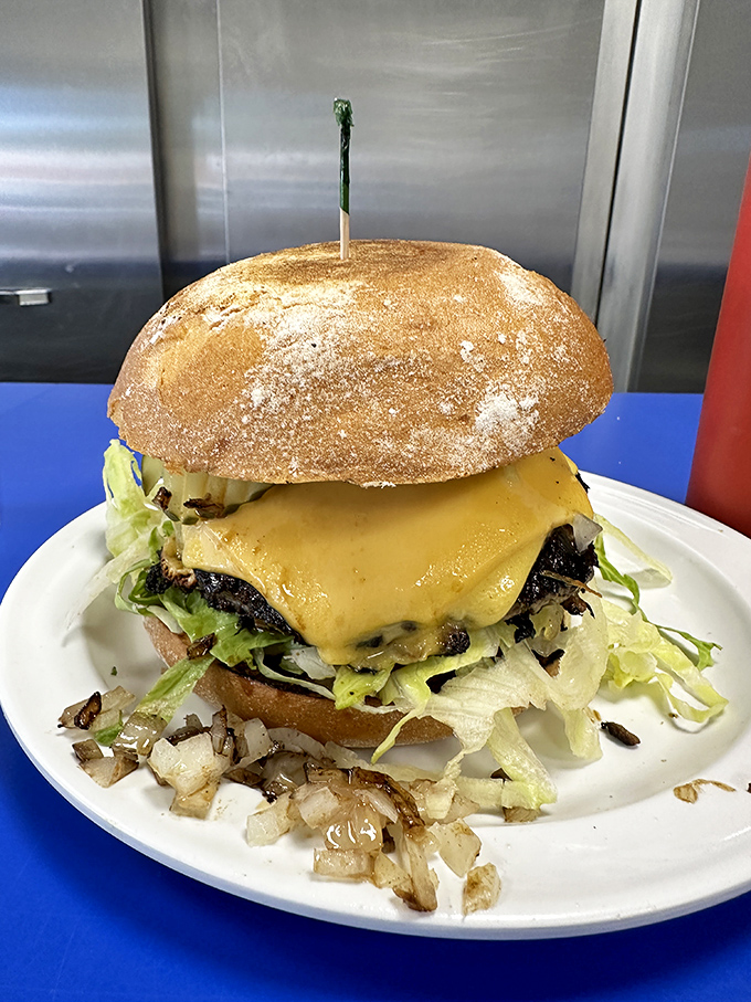 This isn't just a burger&mdash;it's a towering monument to hunger with a perfectly toasted bun and cheese melted with mathematical precision.