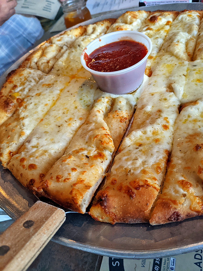 Their cheese pizza isn't just a meal&mdash;it's a canvas of melty perfection with marinara on the side for artistic dipping.