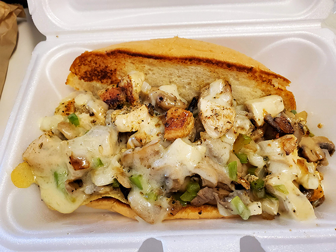The chicken Philly oozes with melted cheese and saut&eacute;ed vegetables, a symphony of flavors in portable form.