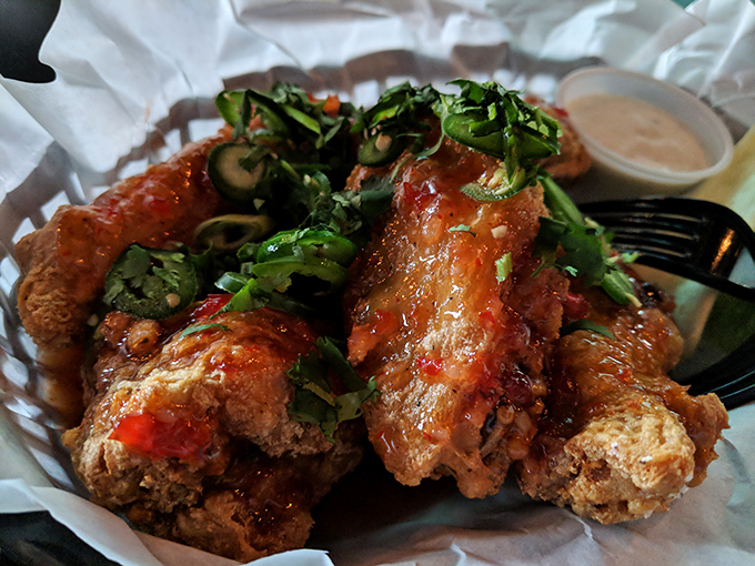 Wings that don't just bring the heat&mdash;they deliver it with style. That sprinkle of fresh herbs is like putting a bow on a spicy gift.