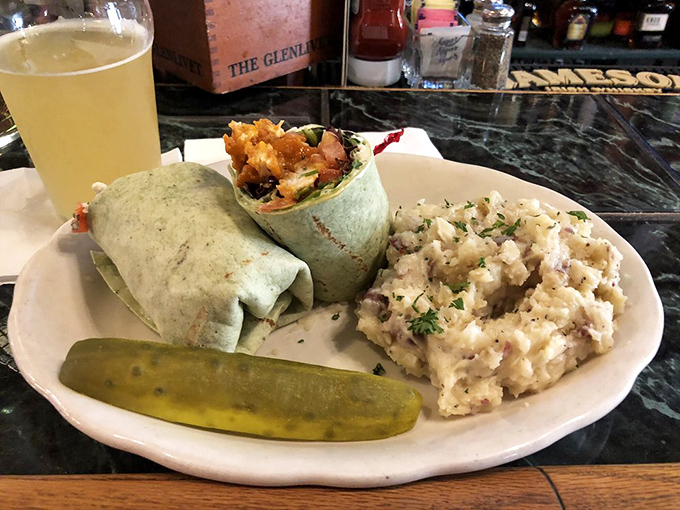 The wrap that launched a thousand lunch breaks &ndash; portable perfection with a pickle spear standing guard.