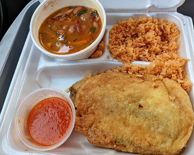 This isn't just lunch &ndash; it's a vacation on a styrofoam plate. Rice, beans, and a chile relleno that demands to be the center of attention.