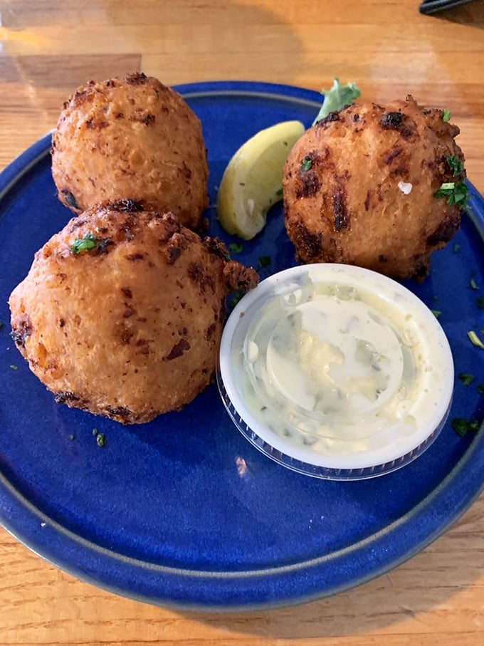 These golden orbs of clam-studded joy arrive piping hot and disappear faster than summer vacation days.