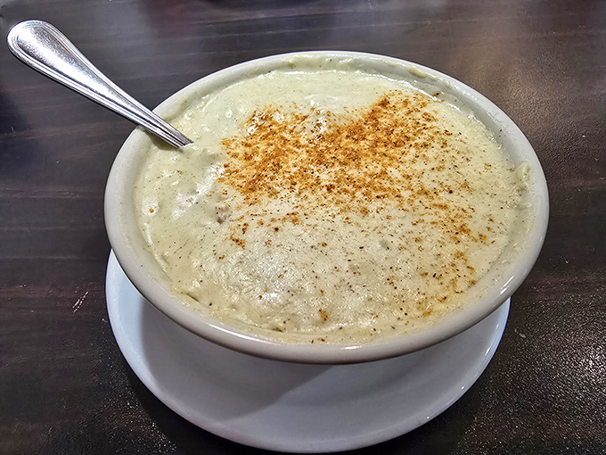Cream of crab soup so rich it should come with its own tax bracket. That dusting of Old Bay on top isn't garnish&mdash;it's essential seasoning that ties the whole experience together.