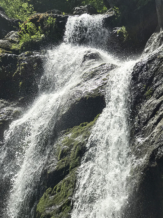 Up close, the falls split into twin streams, like nature decided one waterfall wasn't quite impressive enough for this spot.