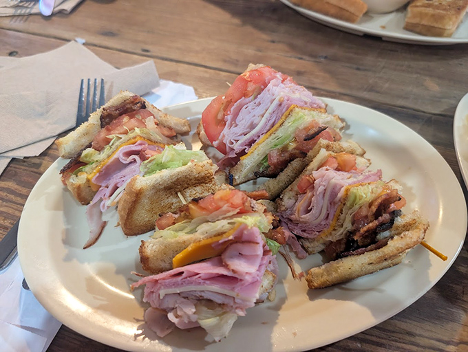 The club sandwich&mdash;stacked higher than some local buildings&mdash;showcases the kitchen's understanding that proper layering is both an art and a science.