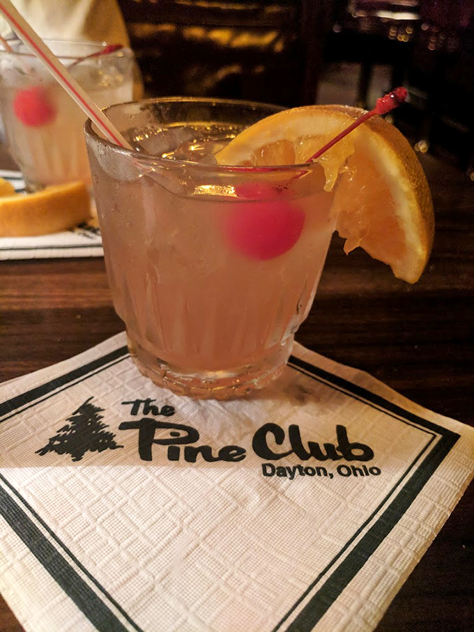 A classic cocktail on The Pine Club's signature napkin—proof that sometimes the simplest pleasures are the most enduring.