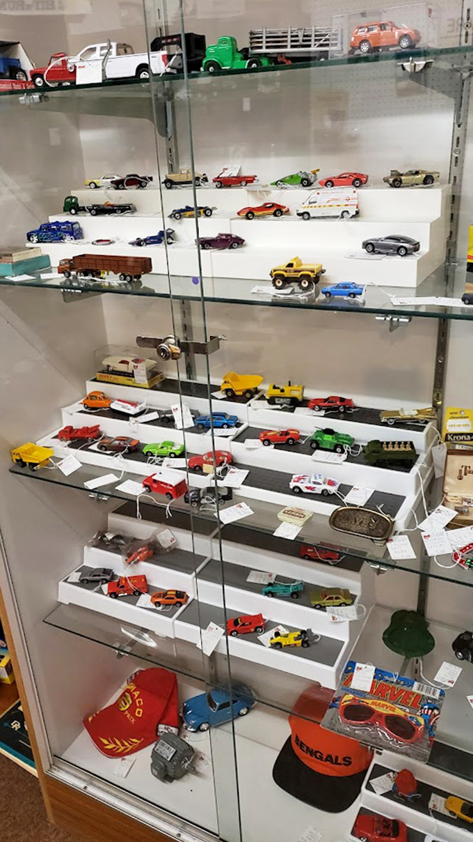 Die-cast dreams behind glass&mdash;where middle-aged men suddenly remember the exact Christmas morning they received that tiny fire truck.