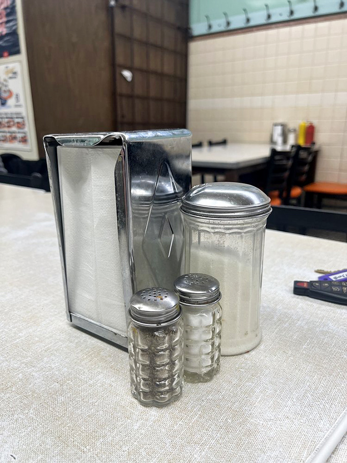 Classic diner condiments stand at attention, ready to enhance your already perfect coney experience.