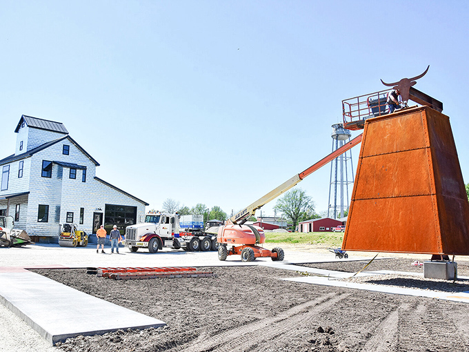 Behind-the-scenes construction photos show the community effort that brought this magnificent vision to life.