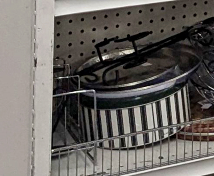 Pots, pans, and baking dishes stack up ready to create future culinary masterpieces or at least some decent weeknight dinners for hungry families.