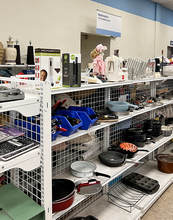 Cookware corner: where cast iron pans with decades of seasoning sit alongside modern kitchen gadgets. Someone's future Sunday pancakes will thank you.