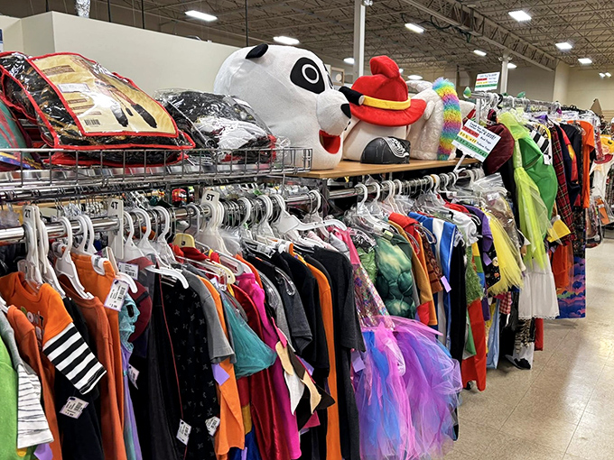 The costume aisle: where Halloween meets theater production. Colorful garments and character heads await their next performance or trick-or-treat adventure.