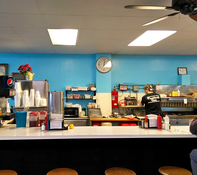 The counter where decisions are made, stories are shared, and the staff remembers how you like your eggs without having to ask.