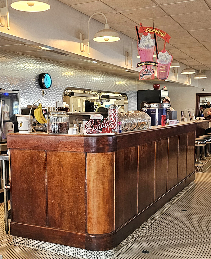 The counter where magic happens. Wood-paneled perfection with promises of milkshakes and friendly conversation.