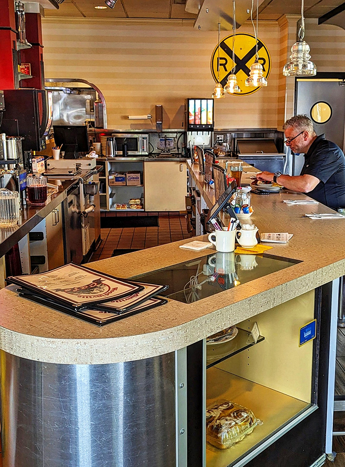 Counter seating: where solo diners become regulars and coffee cups never reach empty. The best show in town is watching breakfast being made.