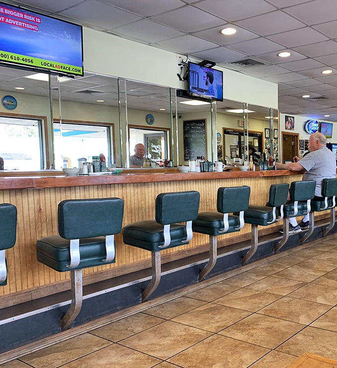 Classic diner counter seating where solo diners find community and the stools have supported generations of satisfied customers.