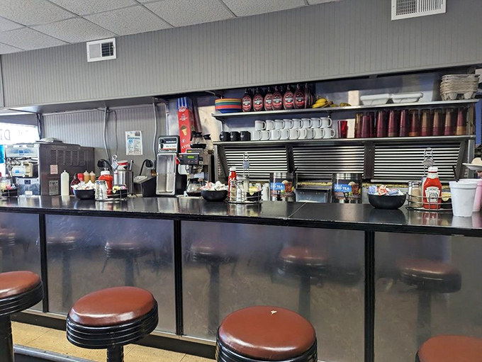 Counter seating: where solo diners become regulars and the coffee refills flow like conversation between old friends.