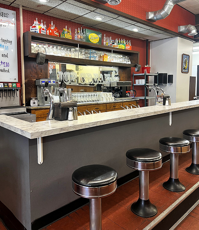 Counter seating: where solo diners become part of the Big Ed's family and the soda jerk's performance art is always center stage.