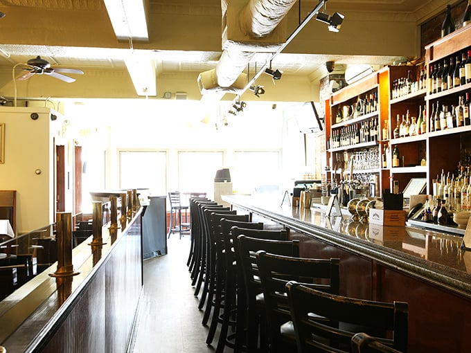 The bar counter&mdash;where solo diners become temporary best friends and bartenders double as maritime storytellers between pours.