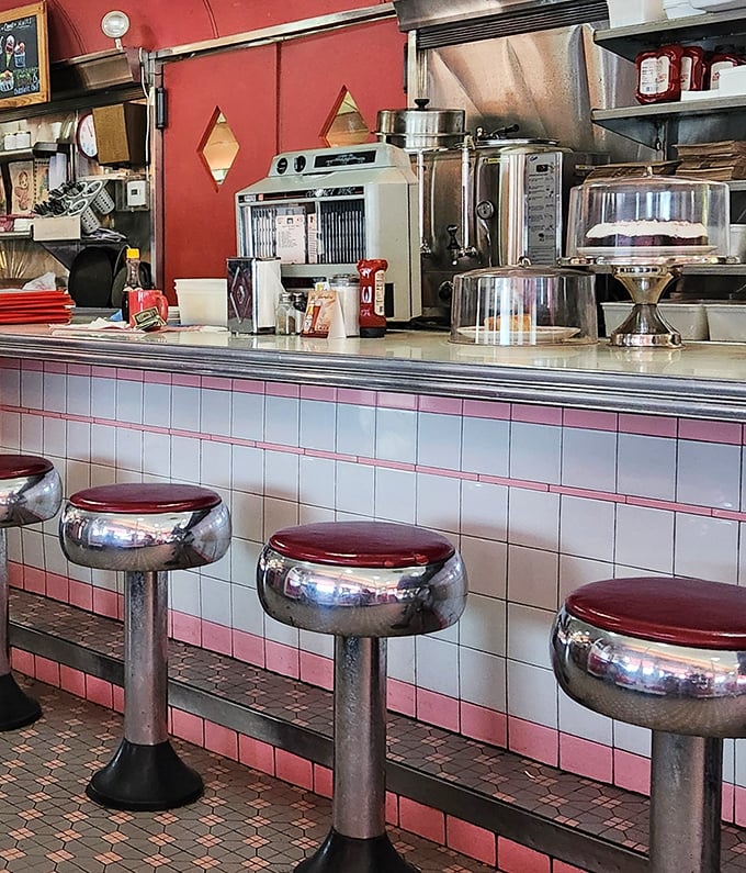 Chrome counter stools with cherry-red tops invite solo diners to belly up for a meal where conversation with neighbors is always on the menu.