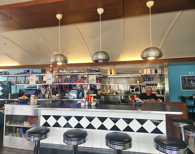 Counter culture at its finest. Those spherical pendant lights and classic swivel stools create the perfect perch for solo dining adventures.