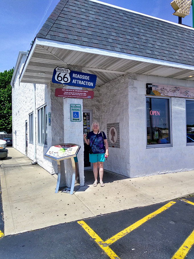 A happy pilgrim at the shrine of Route 66 cuisine. That smile says "I've found the promised land of corn dogs!"