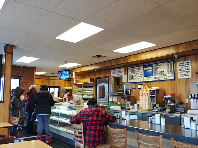 The morning rush at Biagio's&mdash;where plaid shirts meet pastry cases and everyone's united by the universal language of "I need a donut right now."
