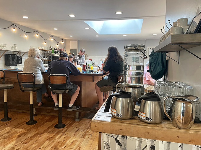 The counter scene&mdash;where breakfast dreams come true. Regulars perch on stools, participating in the morning ritual that makes Winooski feel like home.