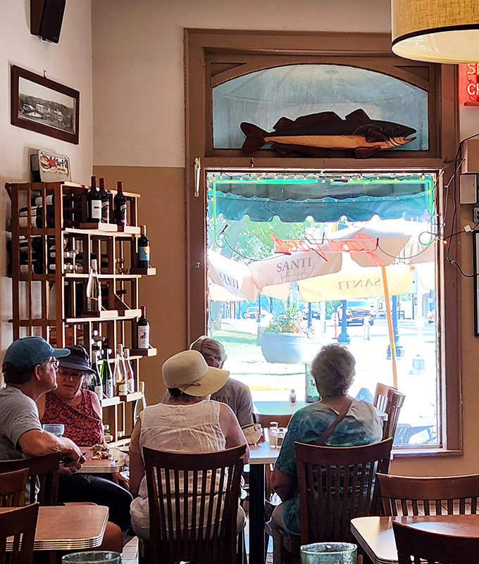 The best tables are by the windows, where sunlight streams in and the fish painting keeps watch. Locals know to request this spot.