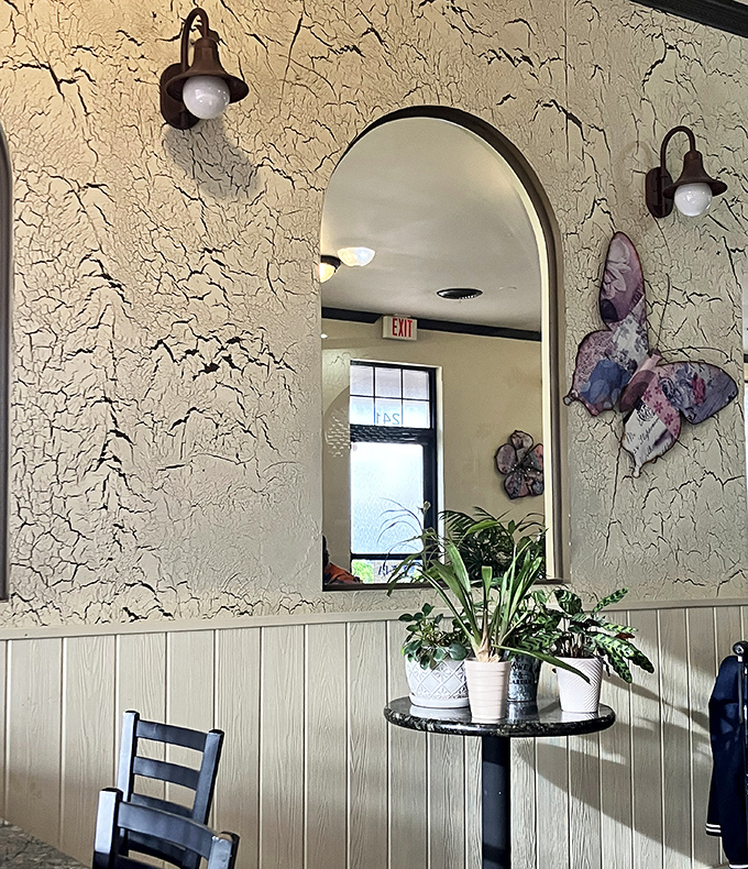 Thoughtful touches like plants and mirrors add warmth without cluttering&mdash;decoration that enhances rather than overwhelms the space.