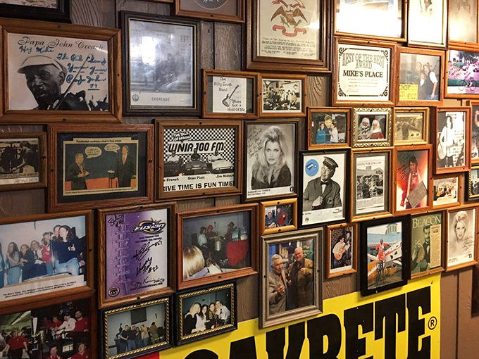 The wall of fame features decades of visitors, celebrities, and memories. Each frame tells a story &ndash; some famous, some local, all part of Mike's legacy.