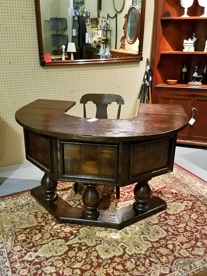 This commanding semi-circular desk wasn't designed for answering emails—it was made for signing important documents with fountain pens and authority.