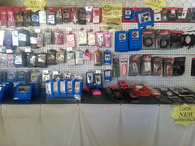 The wall of modern necessities. In the land of forgotten chargers and cracked screens, this vendor is the digital cavalry.