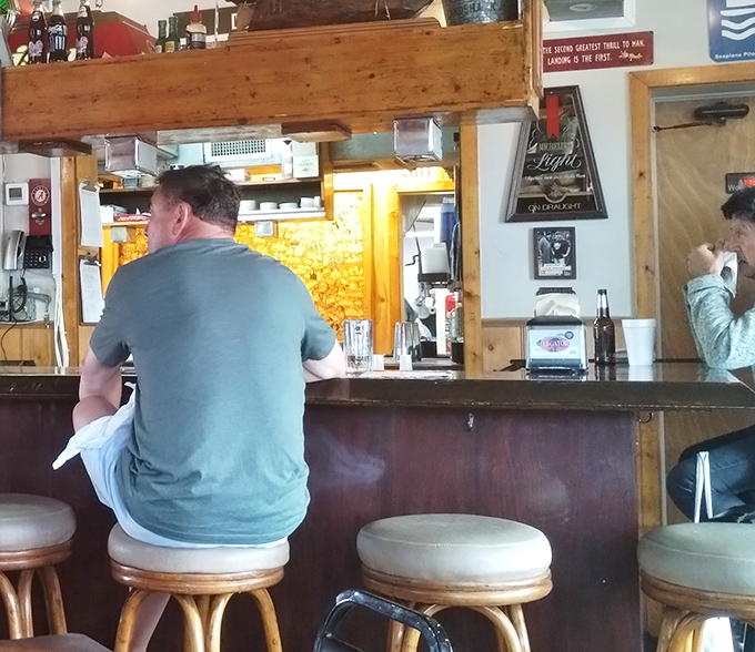 The bar area offers front-row seats to the action, where regulars exchange fishing tales and newcomers become converts.