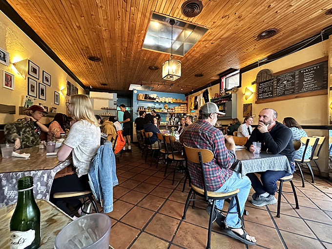 The dining room buzzes with the particular energy that only exists when good food meets good company in just the right proportions.