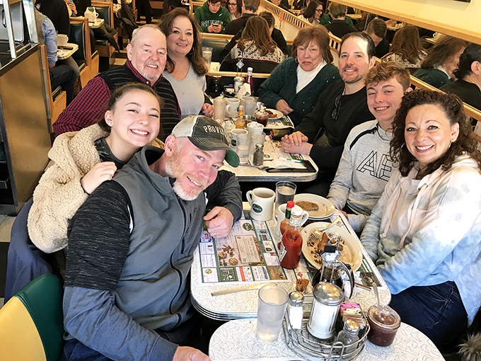 Multi-generational happiness captured in its natural habitat. This isn't just a meal&mdash;it's memory-making with a side of maple syrup.