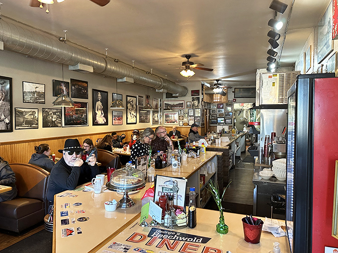 The narrow dining room where strangers become neighbors over the universal language of good food. Every booth tells a story; every plate holds a memory.