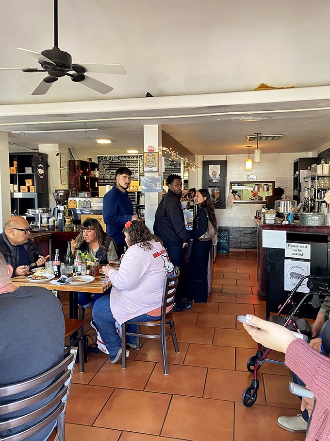 Happy diners savoring their morning feast in this beloved neighborhood breakfast sanctuary.