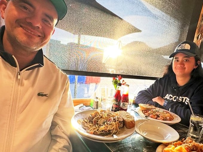 Happy diners with plates that tell the real story &ndash; when the food makes you smile like that, words become secondary.