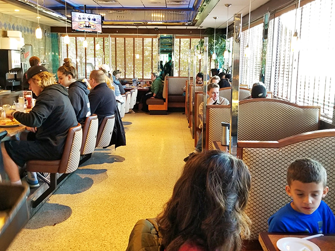 The bustling interior on a typical morning&mdash;where strangers become neighbors over shared appreciation of pancakes and bacon.