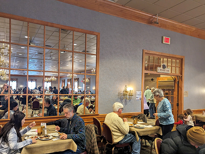 A snapshot of contentment: diners enjoying the fruits of their buffet navigation skills while planning their next strategic plate.